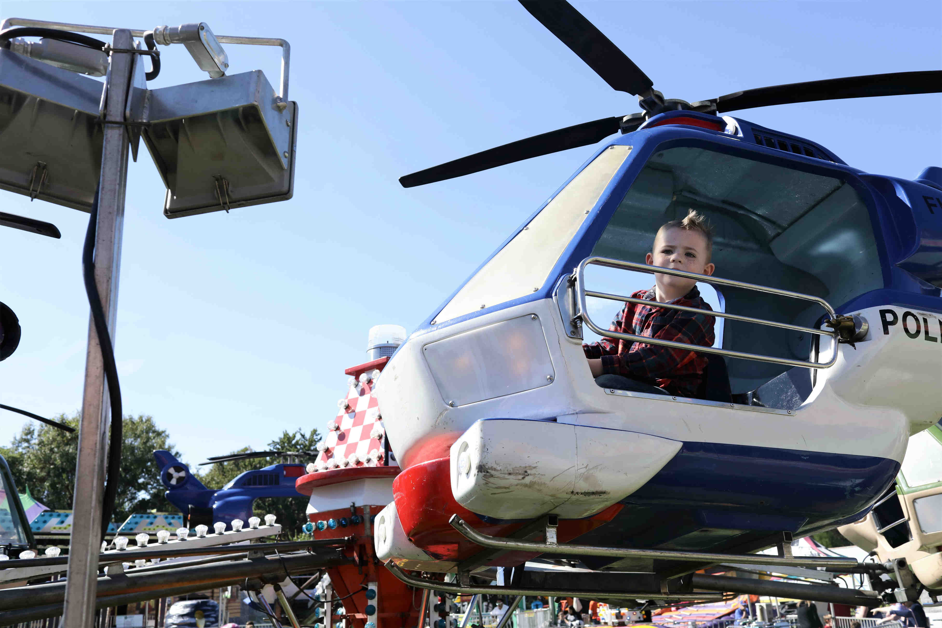 Looking out of the helicopter is Mason Brumage-McKee