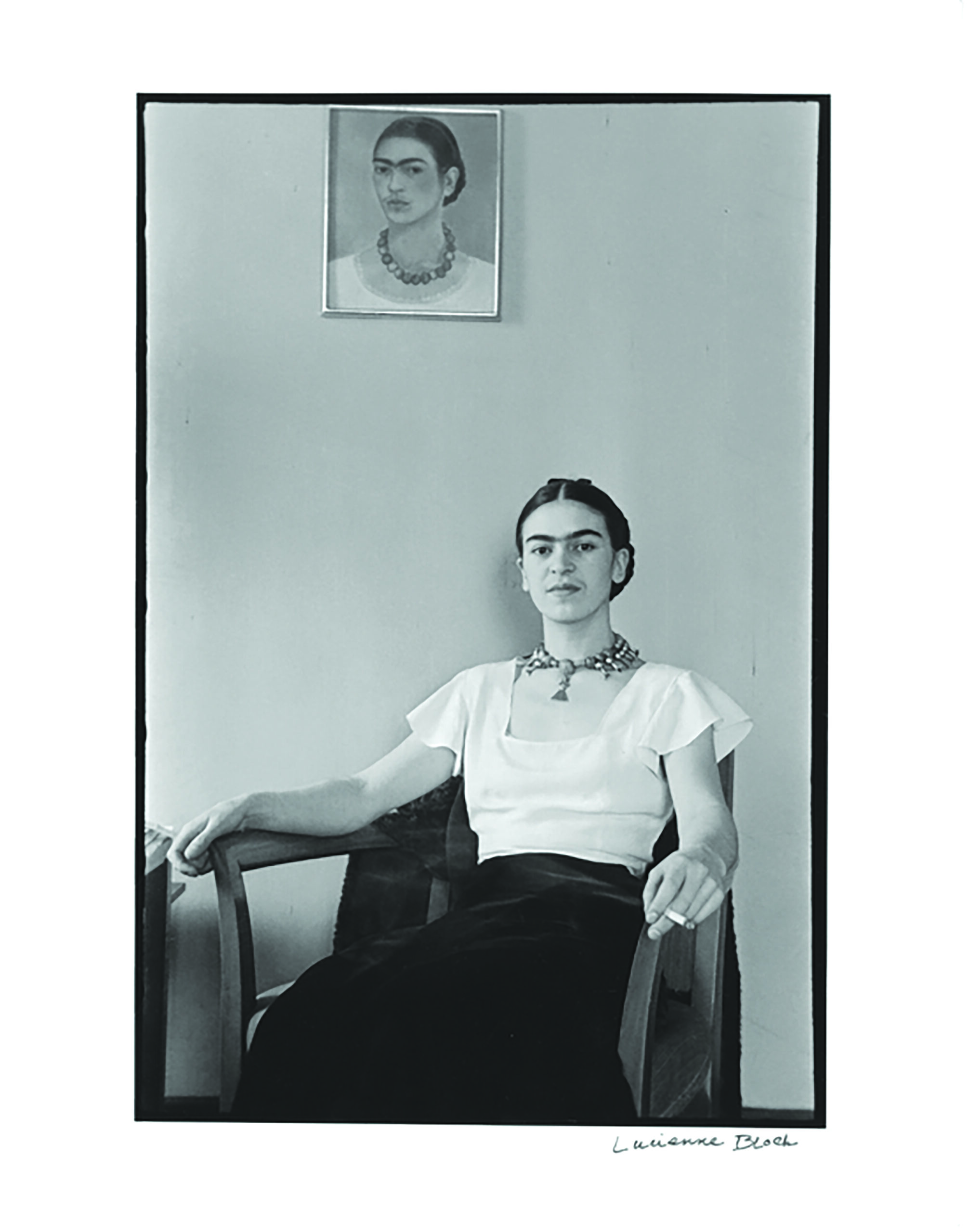 1933_-Frida_sitting_with_self-portrait_Credit-Photo-by-Lucienne-Bloch ...